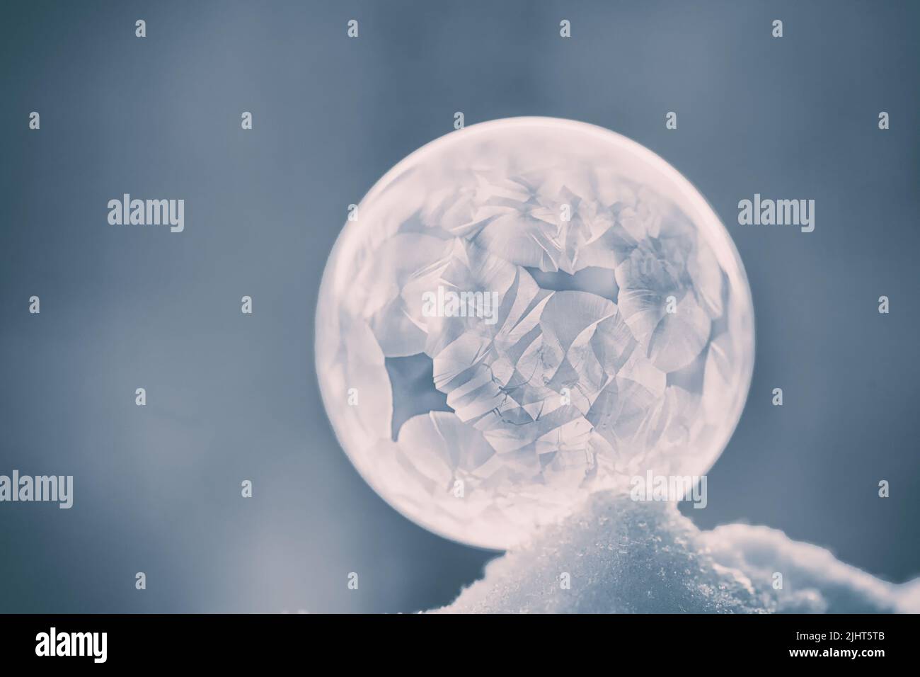 A closeup of frozen soap bubble with beautiful crystal formations on ...