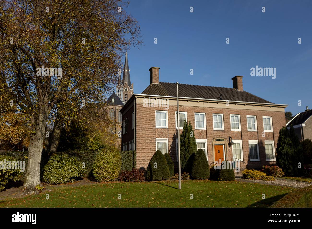 Large Dutch brick exterior facade of stately home surrounded by autumn ...