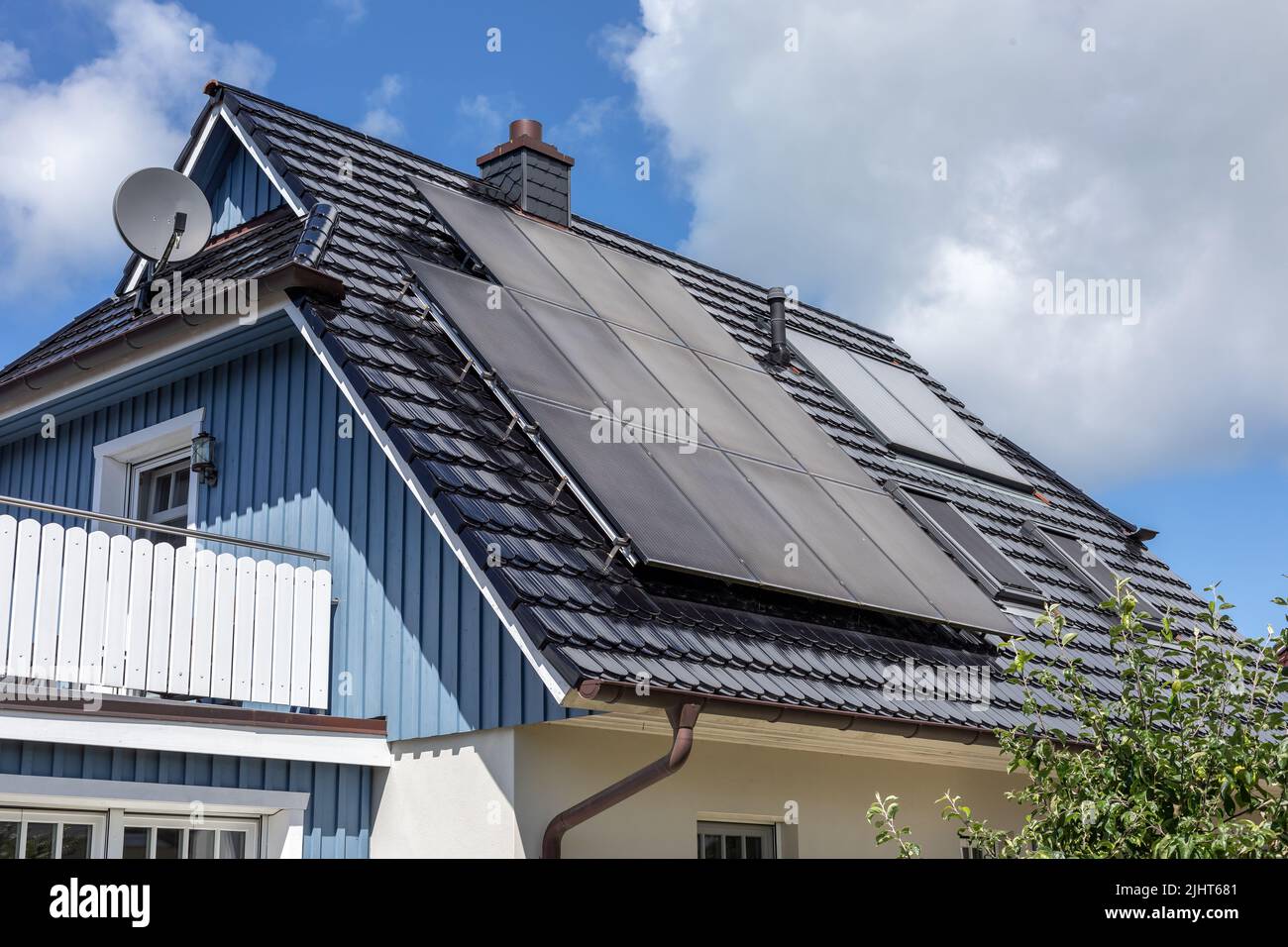 solar systems on the pitched roof of a family home Stock Photo - Alamy