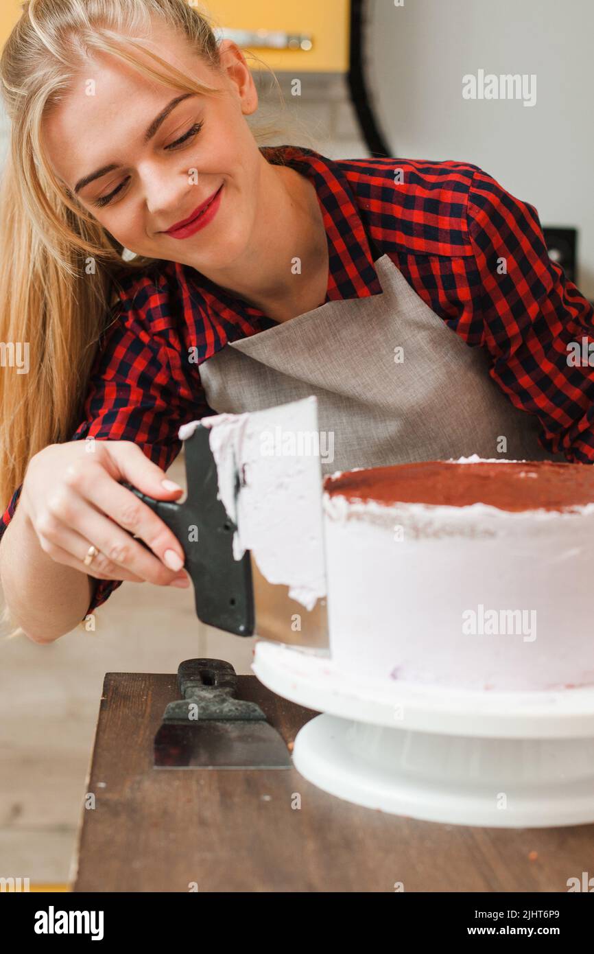 Girl making sweet dessert on kitchen. Masterclass Stock Photo - Alamy