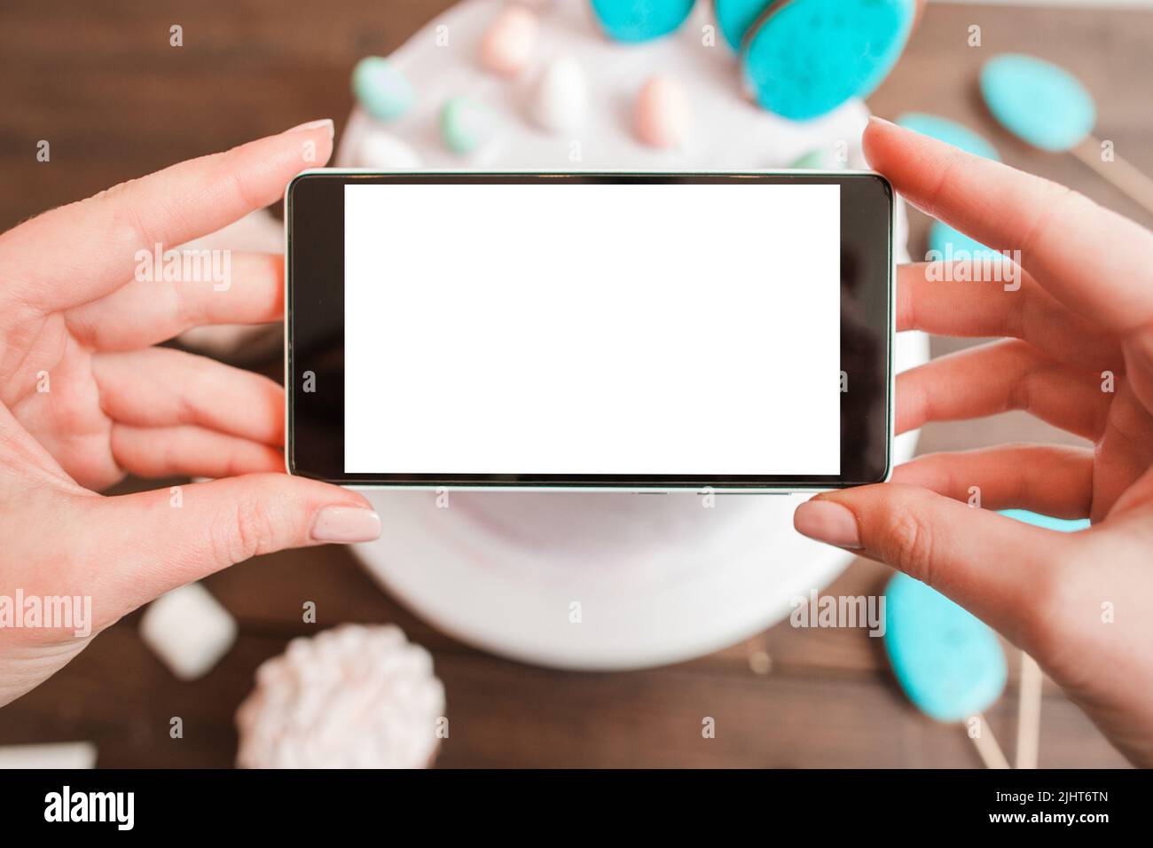 Food photo of cake by smartphone. Blank screen Stock Photo - Alamy