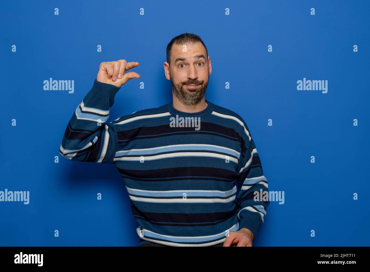 Spanish man making a gesture, isolated, like telling us to be careful ...
