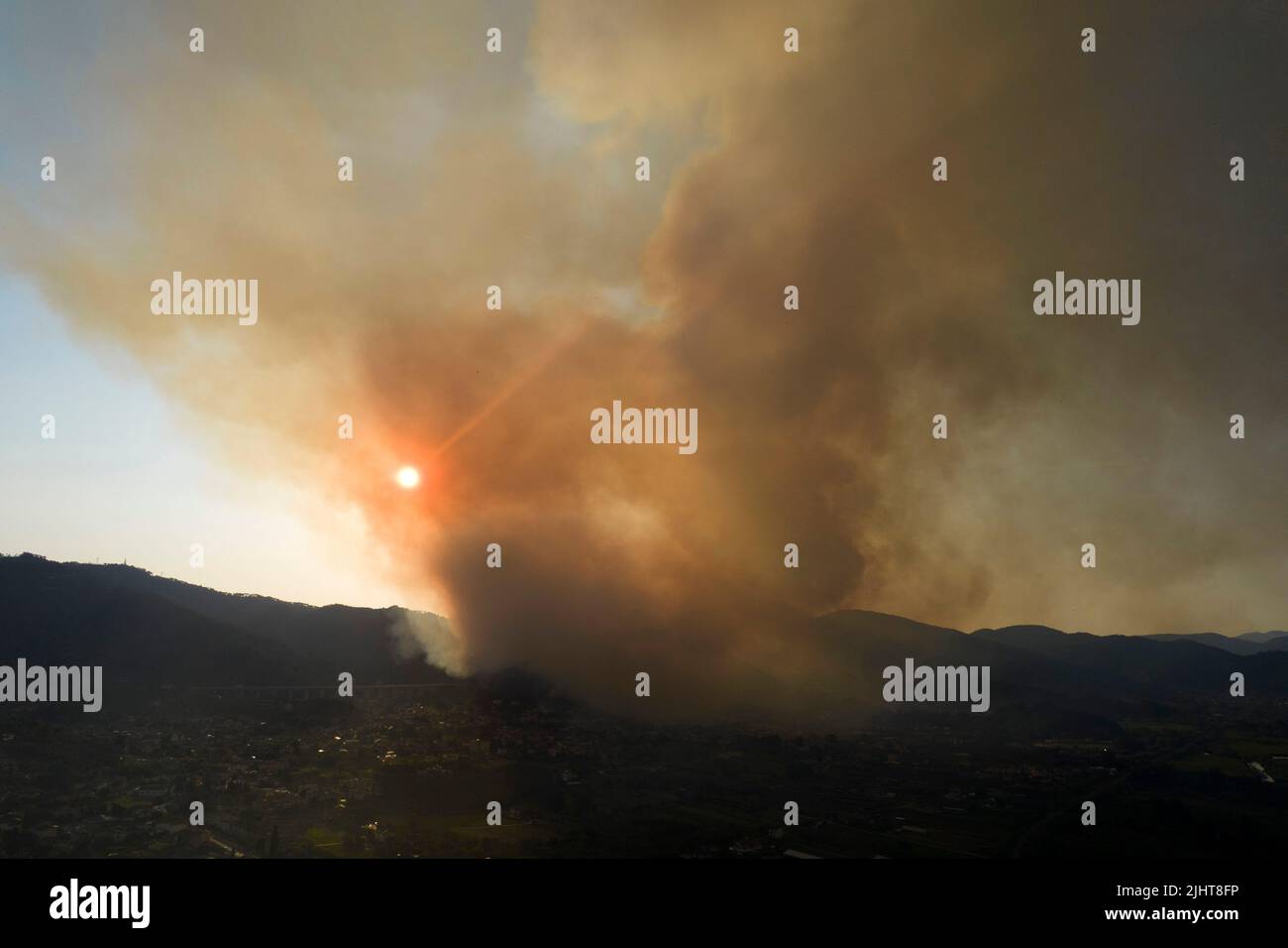 Photographic documentation of a large column of smoke caused by a ...