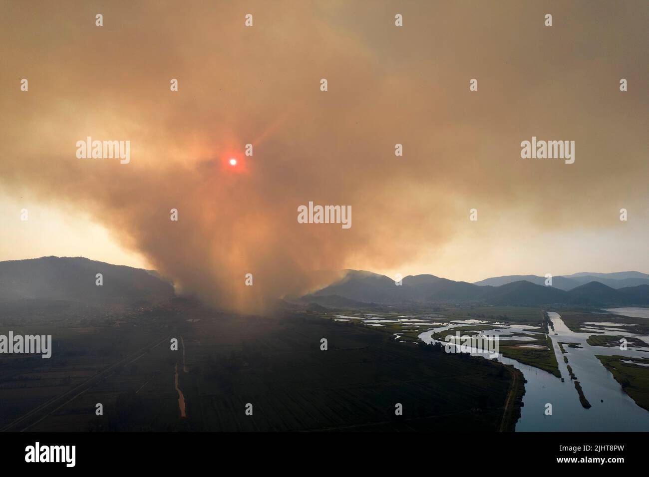 Photographic documentation of a large column of smoke caused by a ...