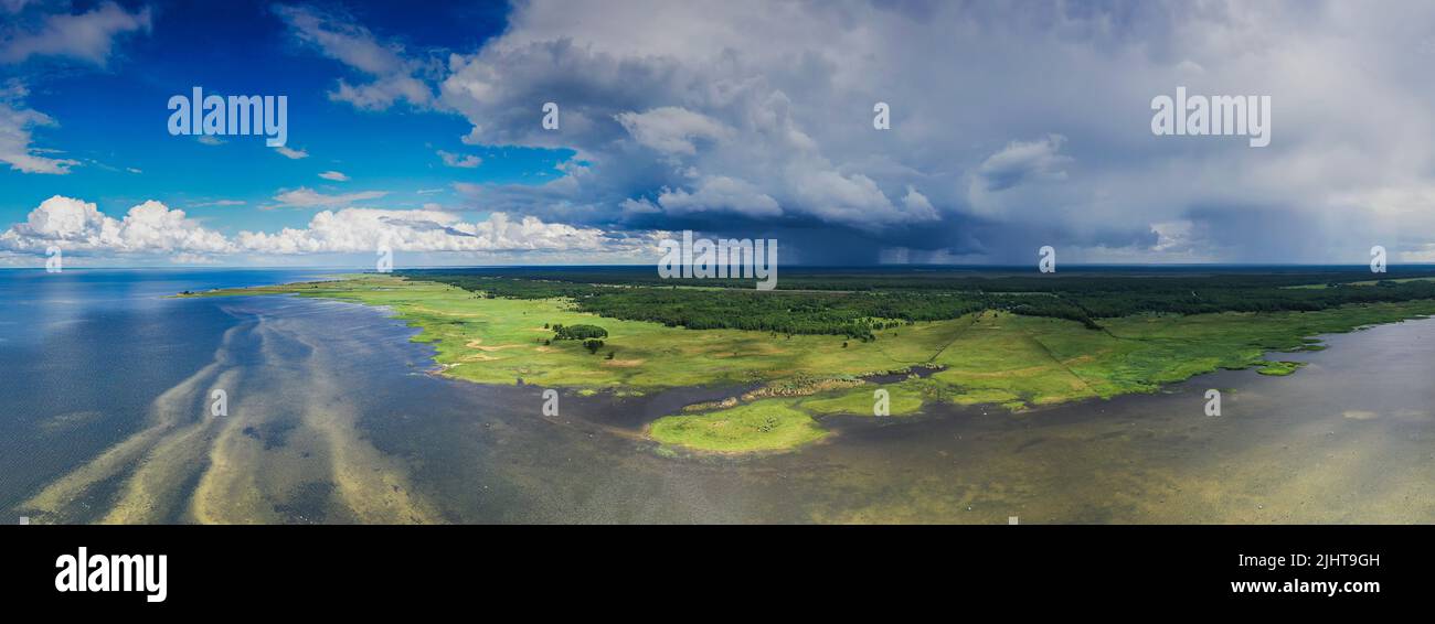 Aerial panoramic view to the shallow coastal sea with sandbanks, green ...