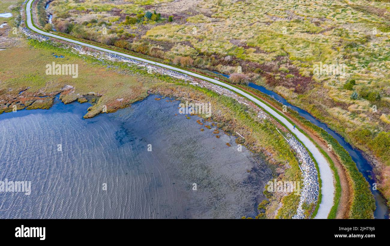 The aerial of the small coastal road in Mud Bay Park, Surrey, Canada ...