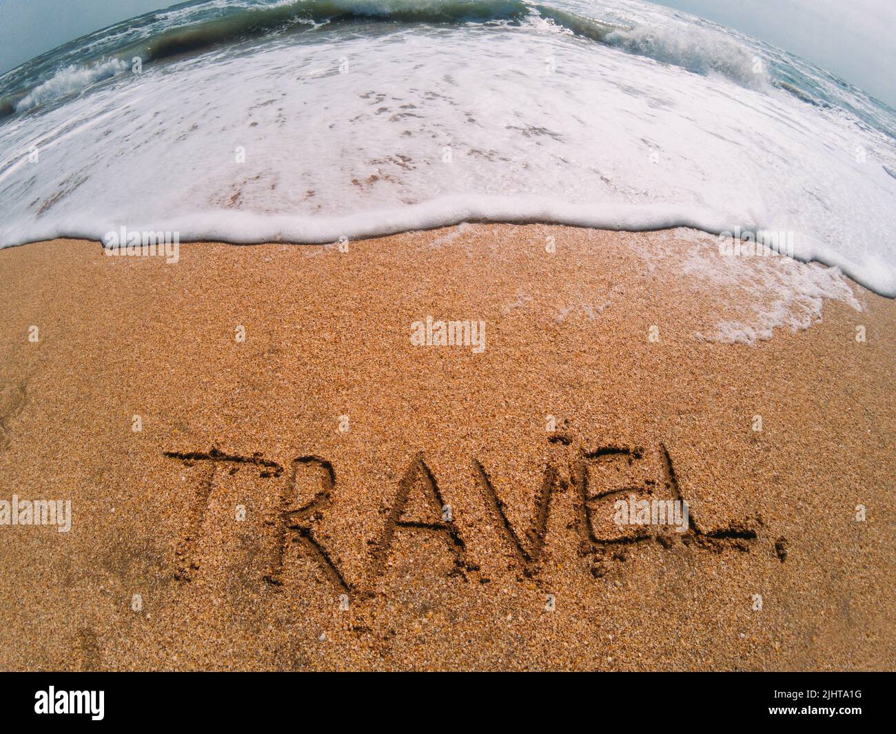 travel word sand wave tide vacation journey summer Stock Photo - Alamy