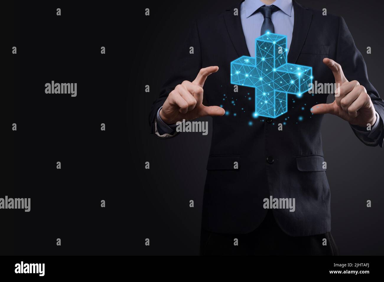 Businessman hand holding 3D plus low polygonal icon.Plus sign virtual ...