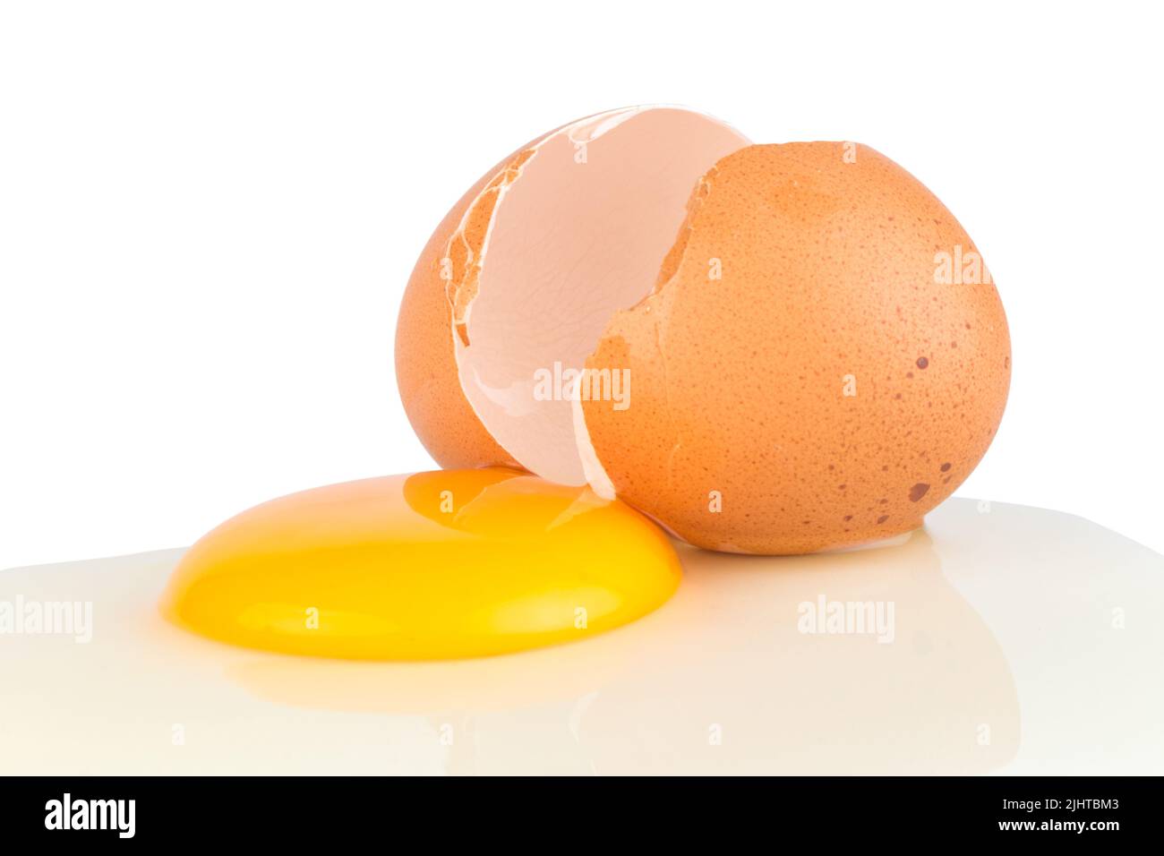 egg broken closeup isolated on white background Stock Photo - Alamy