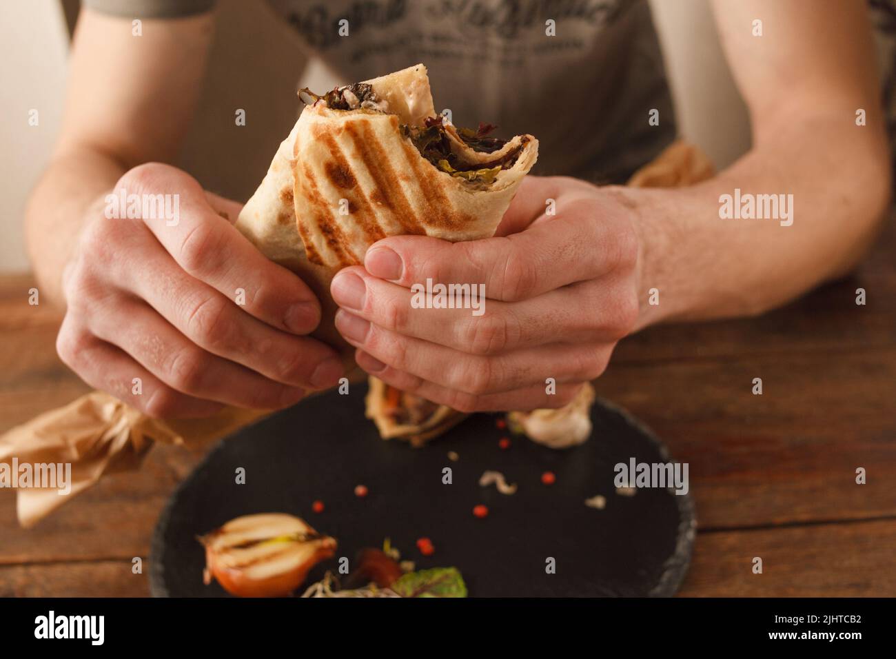 Man eating shawarma close up Stock Photo - Alamy