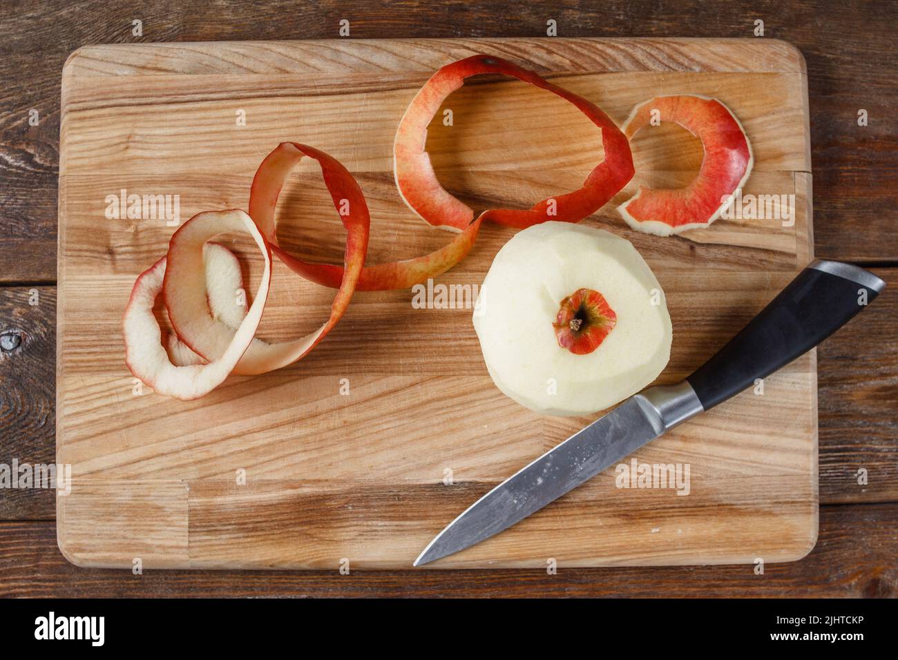 Single apple paring by knife Stock Photo - Alamy