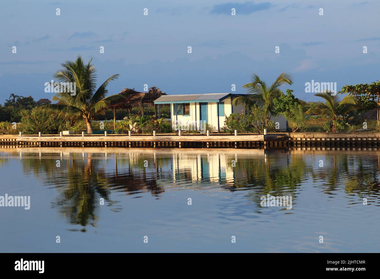 PLACENCIA, BELIZE - SEPTEMBER 21, 2016 small morning sun on a house and ...