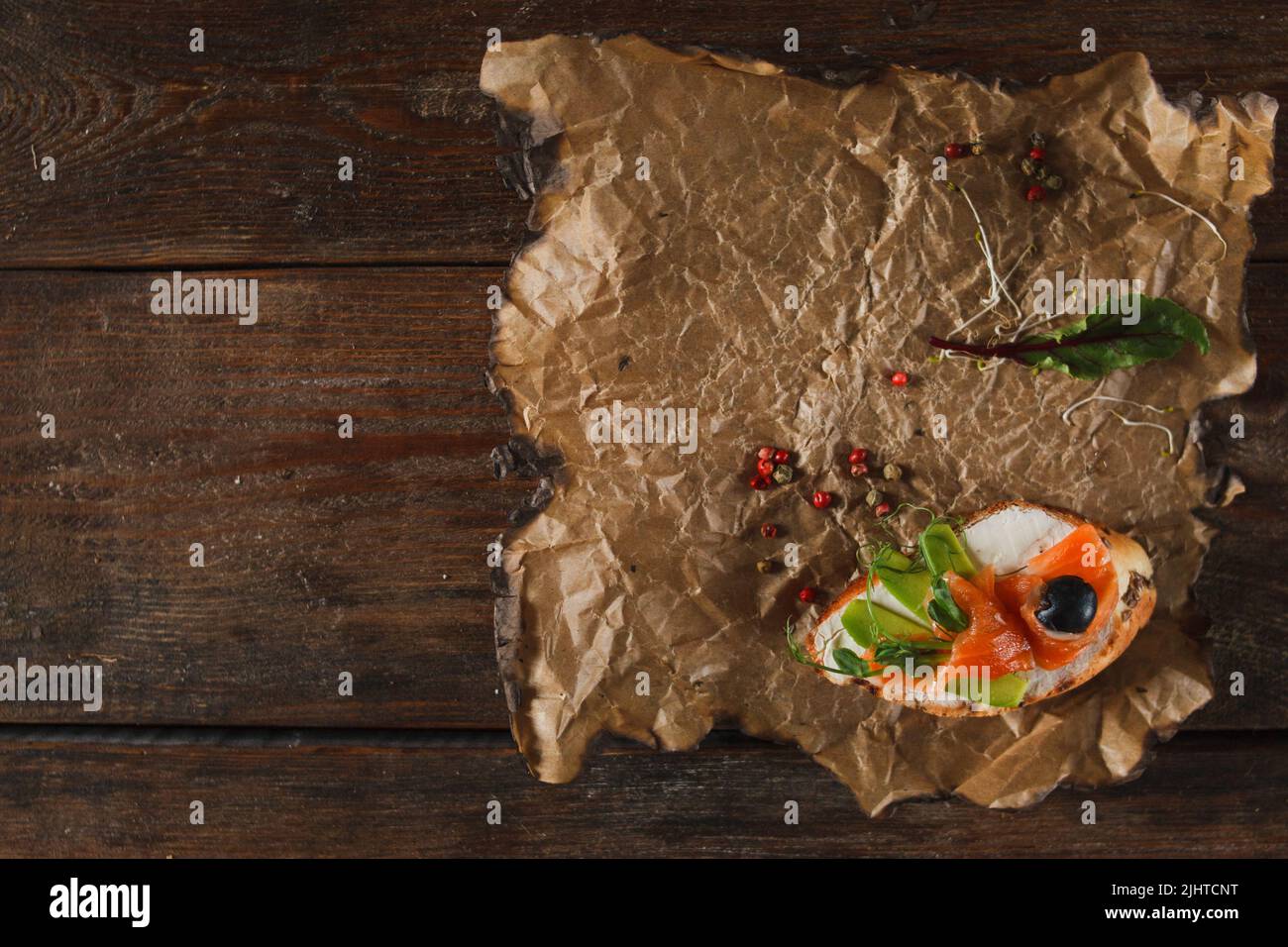 Small canape laying on aged paper Stock Photo - Alamy