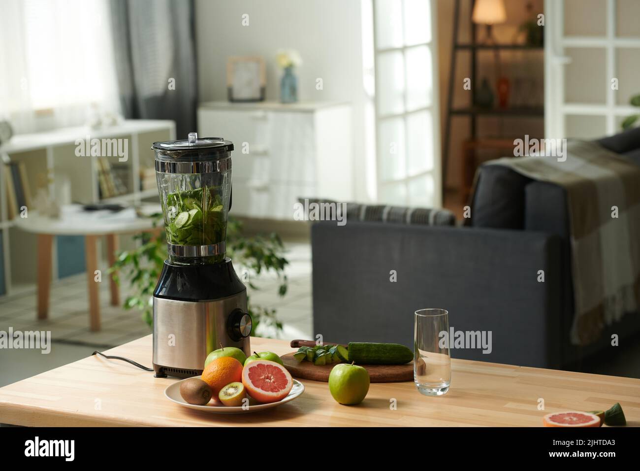 Horizontal image of kitchen table with fresh fruits and vegetables for ...