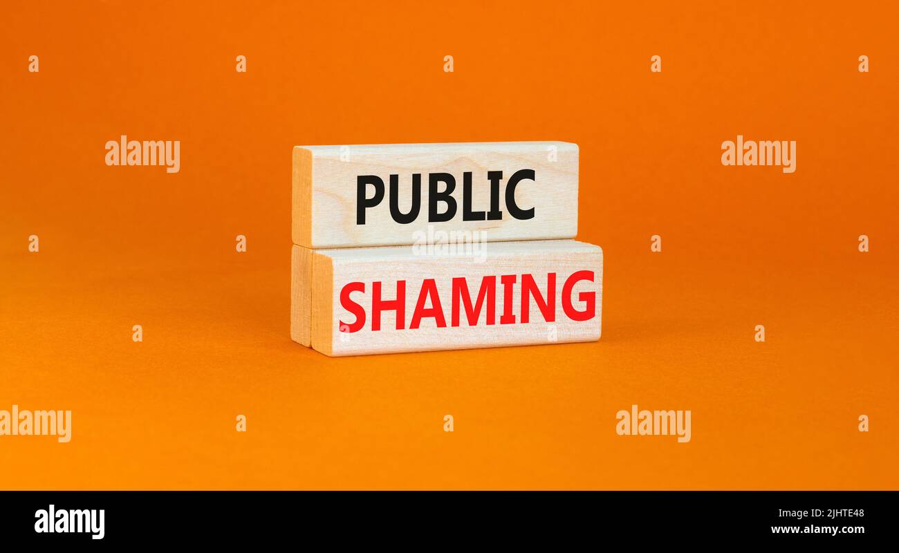 Public shaming symbol. Concept words Public shaming on wooden blocks on ...