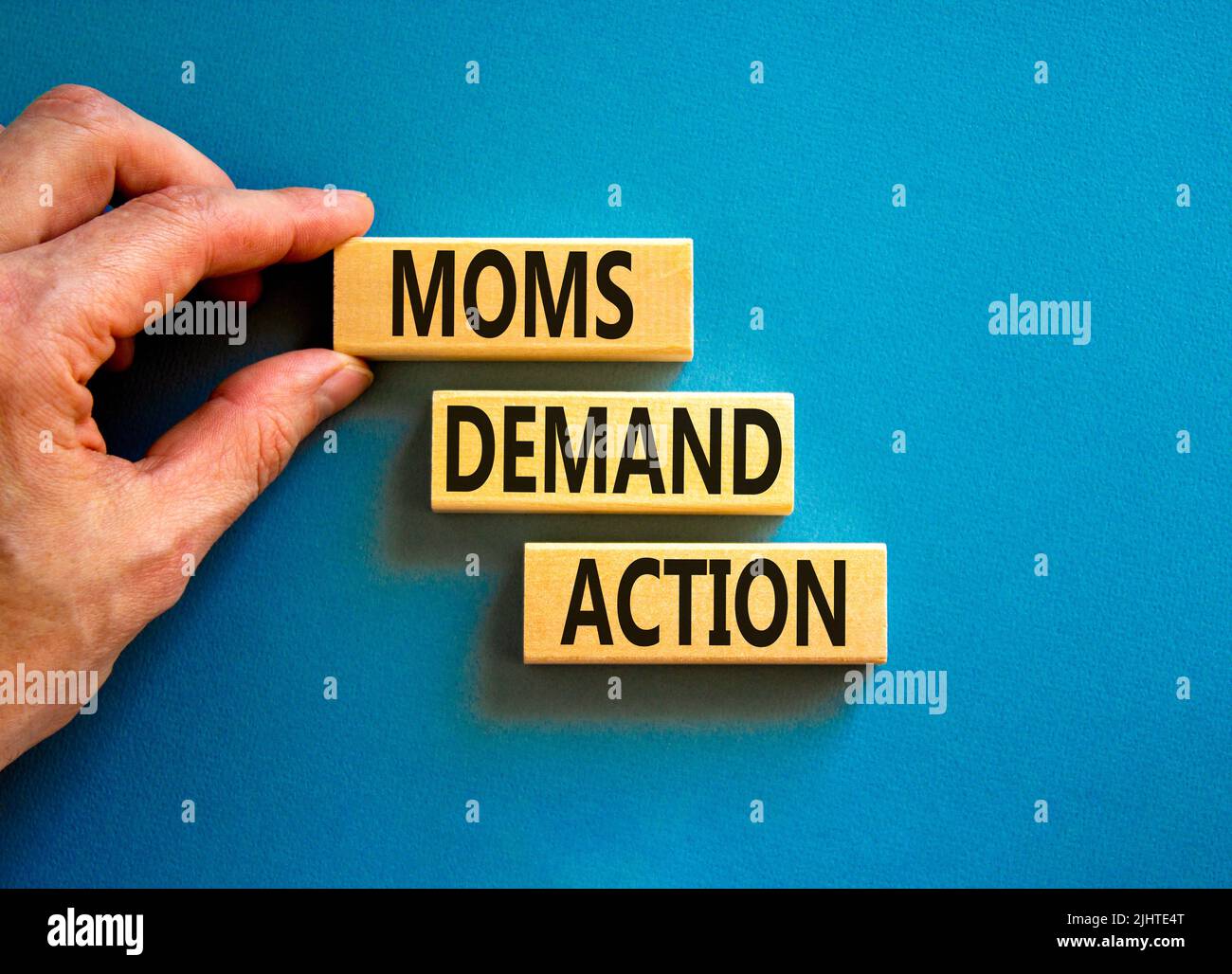 Moms demand action symbol. Concept words Moms demand action on wooden ...