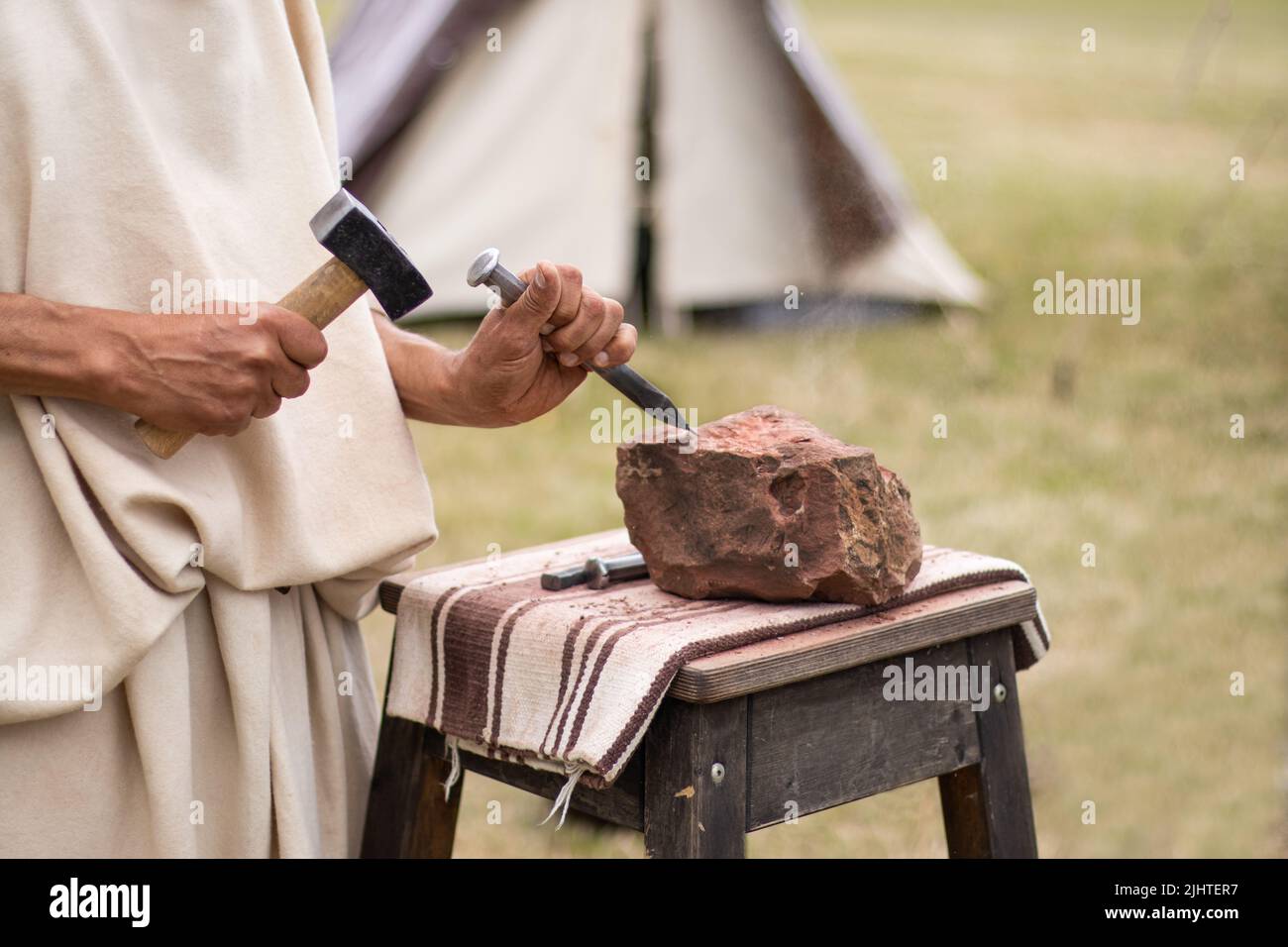 Craft, man working stone with hammer and chisel, handicraft and art ...