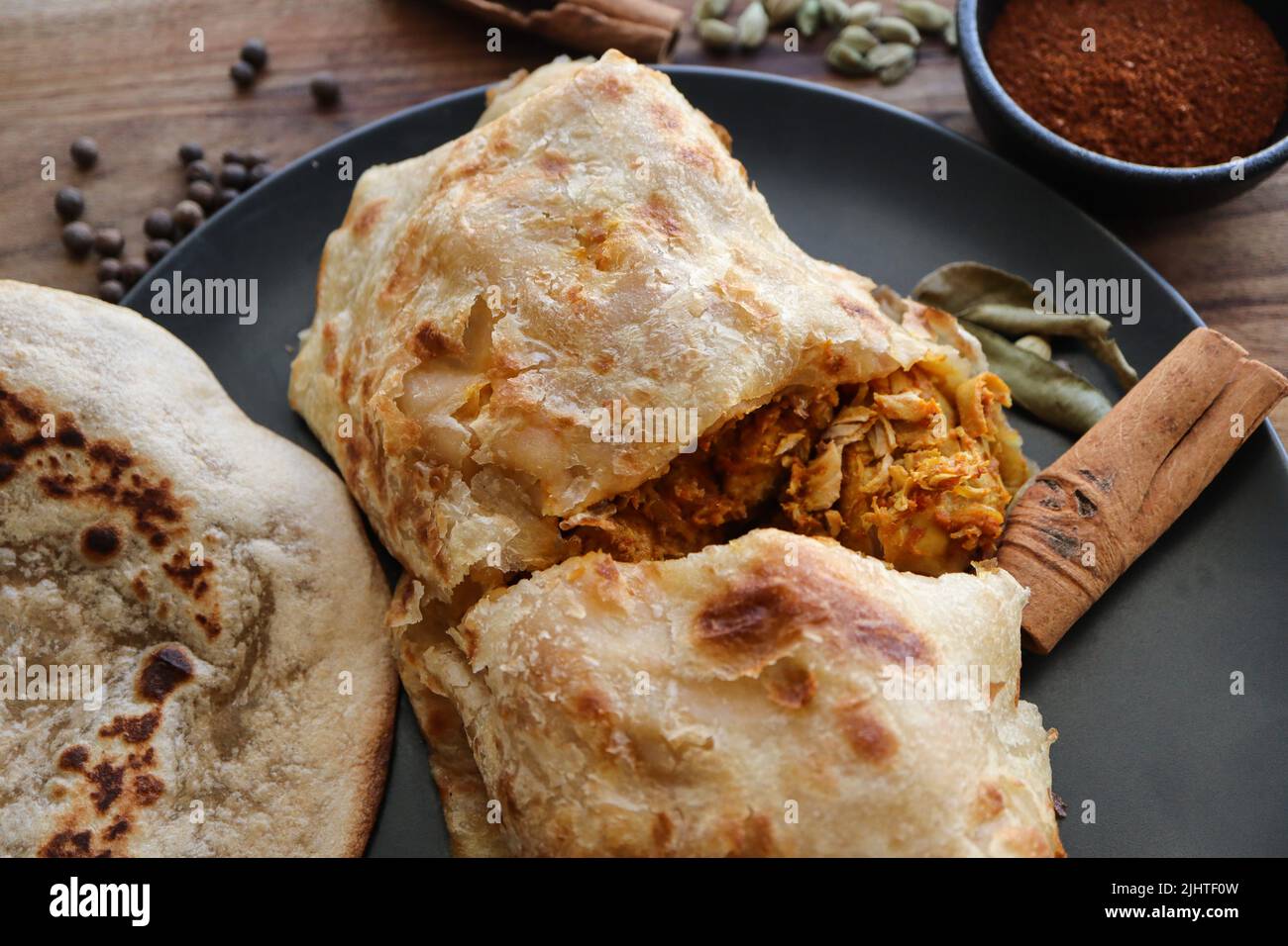 Chicken curry roti or salomie. Traditional food, a salomie roti filled ...