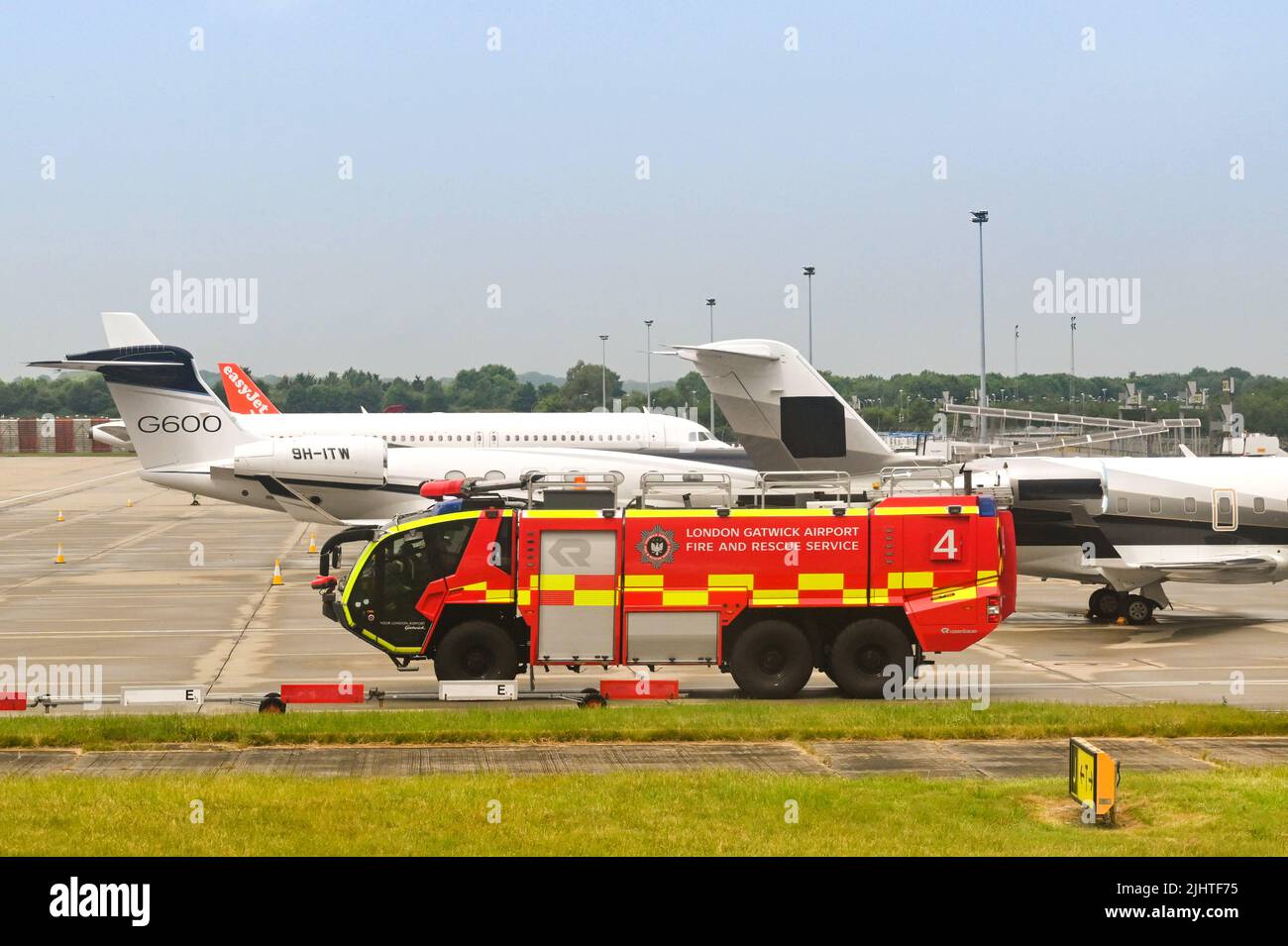 London, England - June 2022: Airport fire tender driving across the ...
