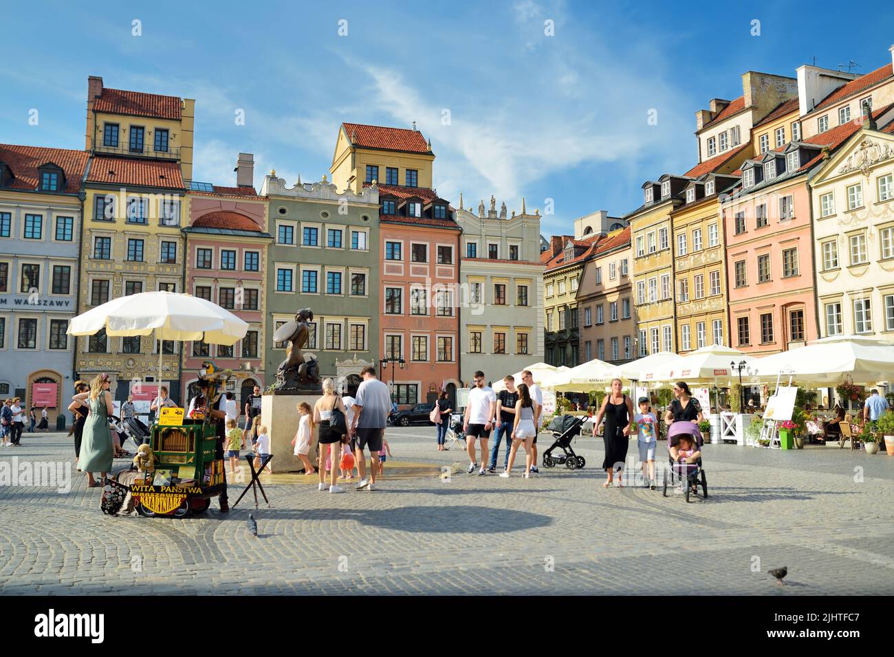 WARSAW, POLAND - AUGUST 2021: Tourists explore beautiful Old Town ...