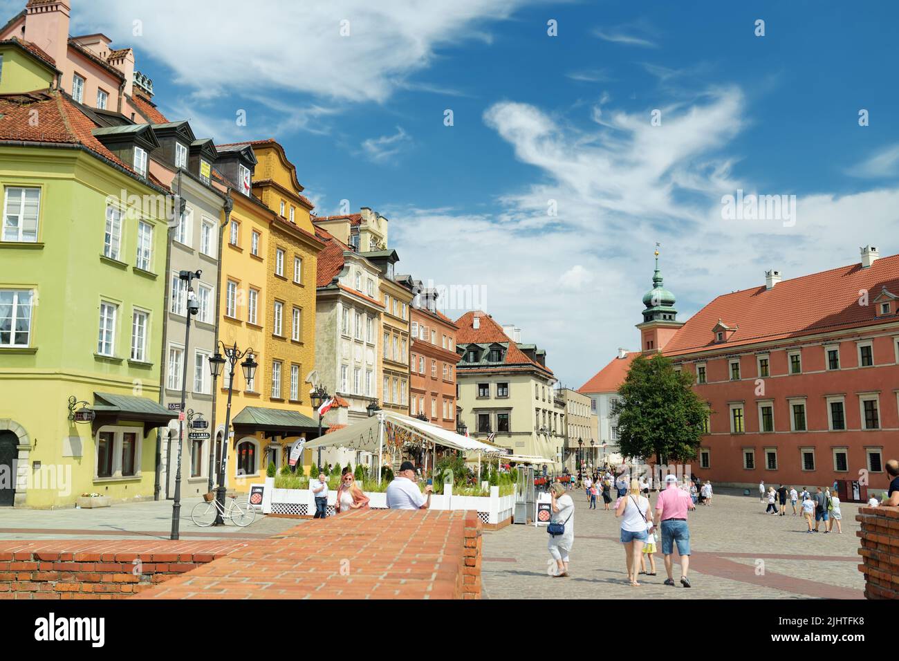 WARSAW, POLAND - AUGUST 2021: Tourists explore beautiful streets of the ...