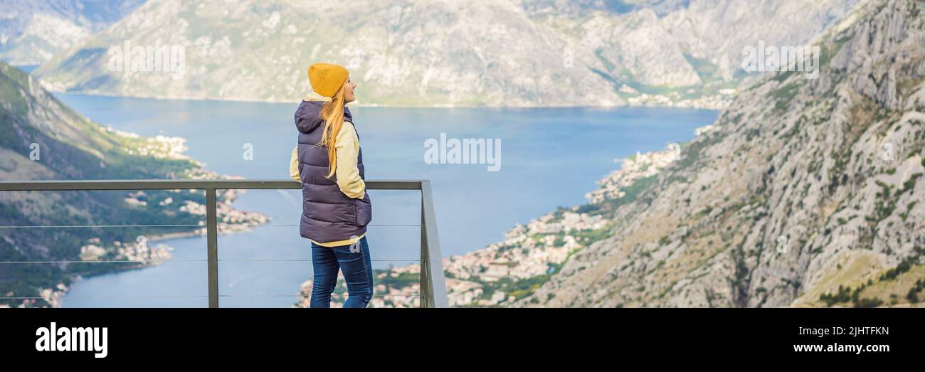 BANNER, LONG FORMAT Woman tourist enjoys the view of Kotor. Montenegro ...