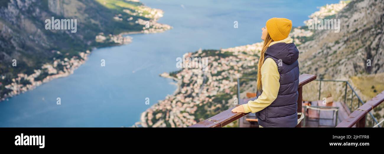 BANNER, LONG FORMAT Woman tourist enjoys the view of Kotor. Montenegro ...