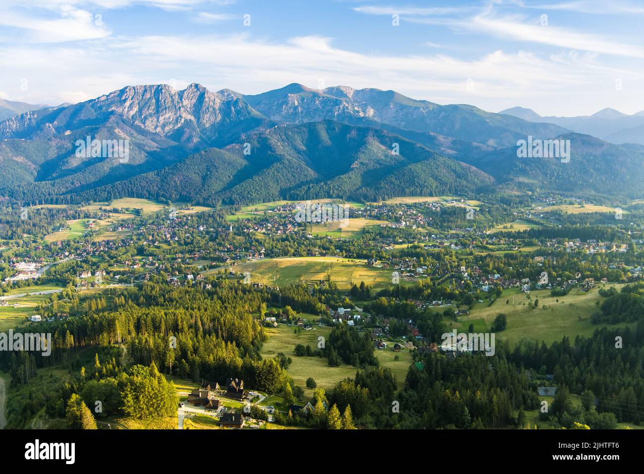 Aerial view of Zakopane town underneath Tatra Mountains taken from the ...