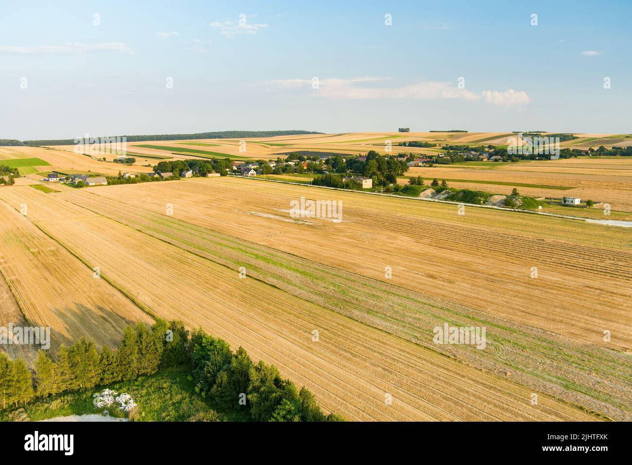 Aerial view of agricultural parcels of different crops. Road winding ...