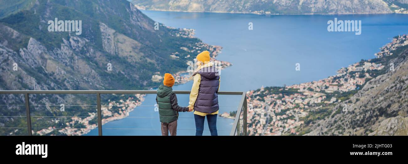 BANNER, LONG FORMAT Mother and son travellers enjoys the view of Kotor ...