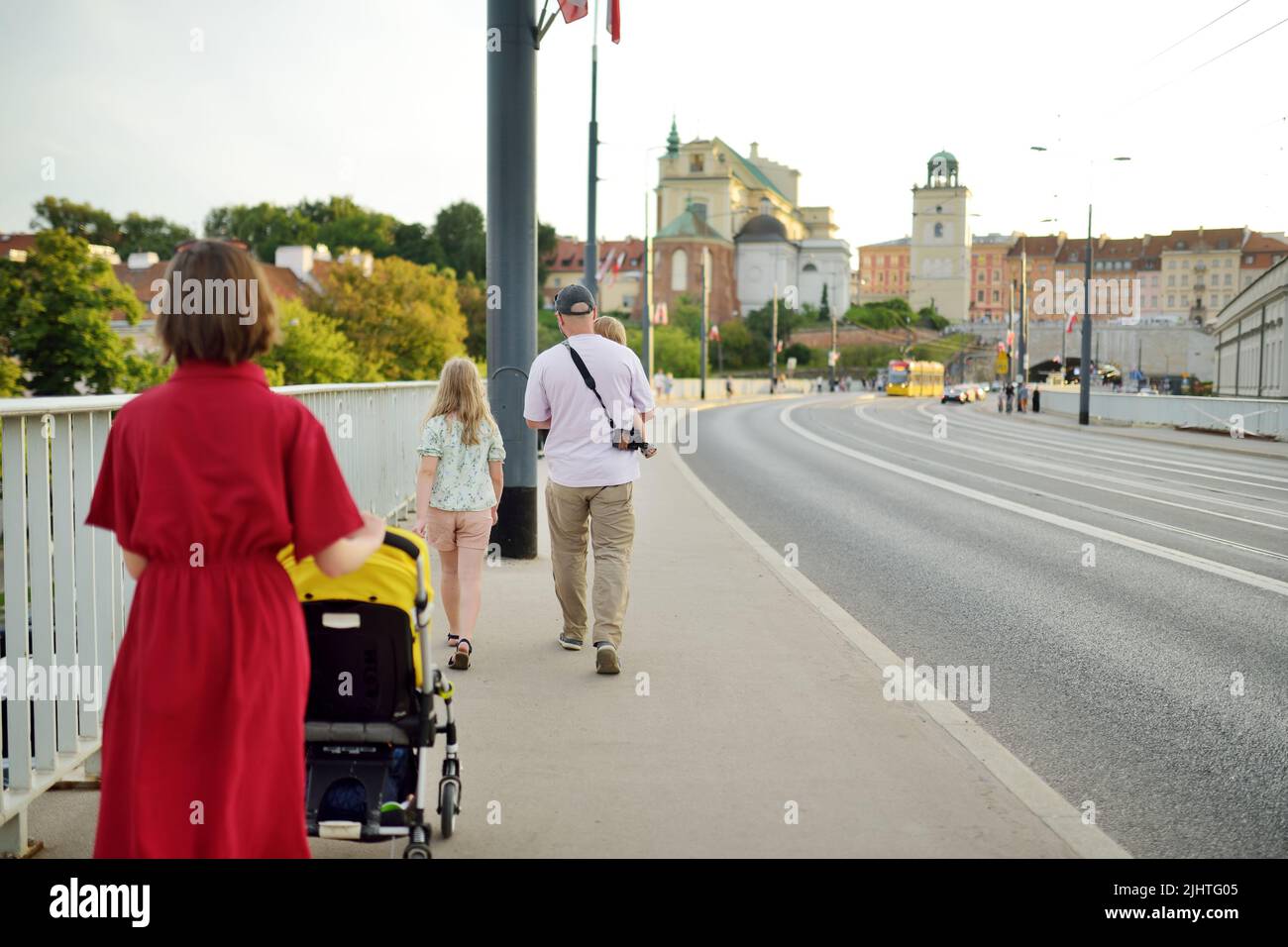 Father and his three kids explore beautiful streets of Warsaw's Old ...