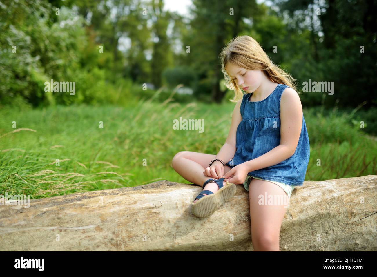 Cute young girl having fun outdoors on sunny summer day. Child ...