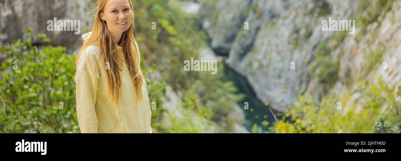 BANNER, LONG FORMAT Woman tourist in the background of Beautiful Canyon ...