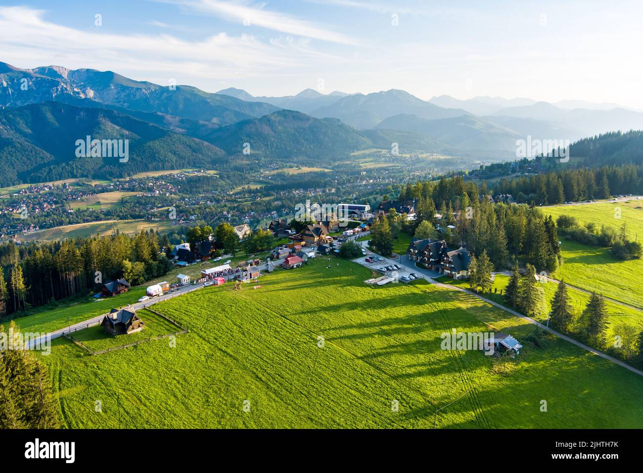 Aerial view of Zakopane town underneath Tatra Mountains taken from the ...