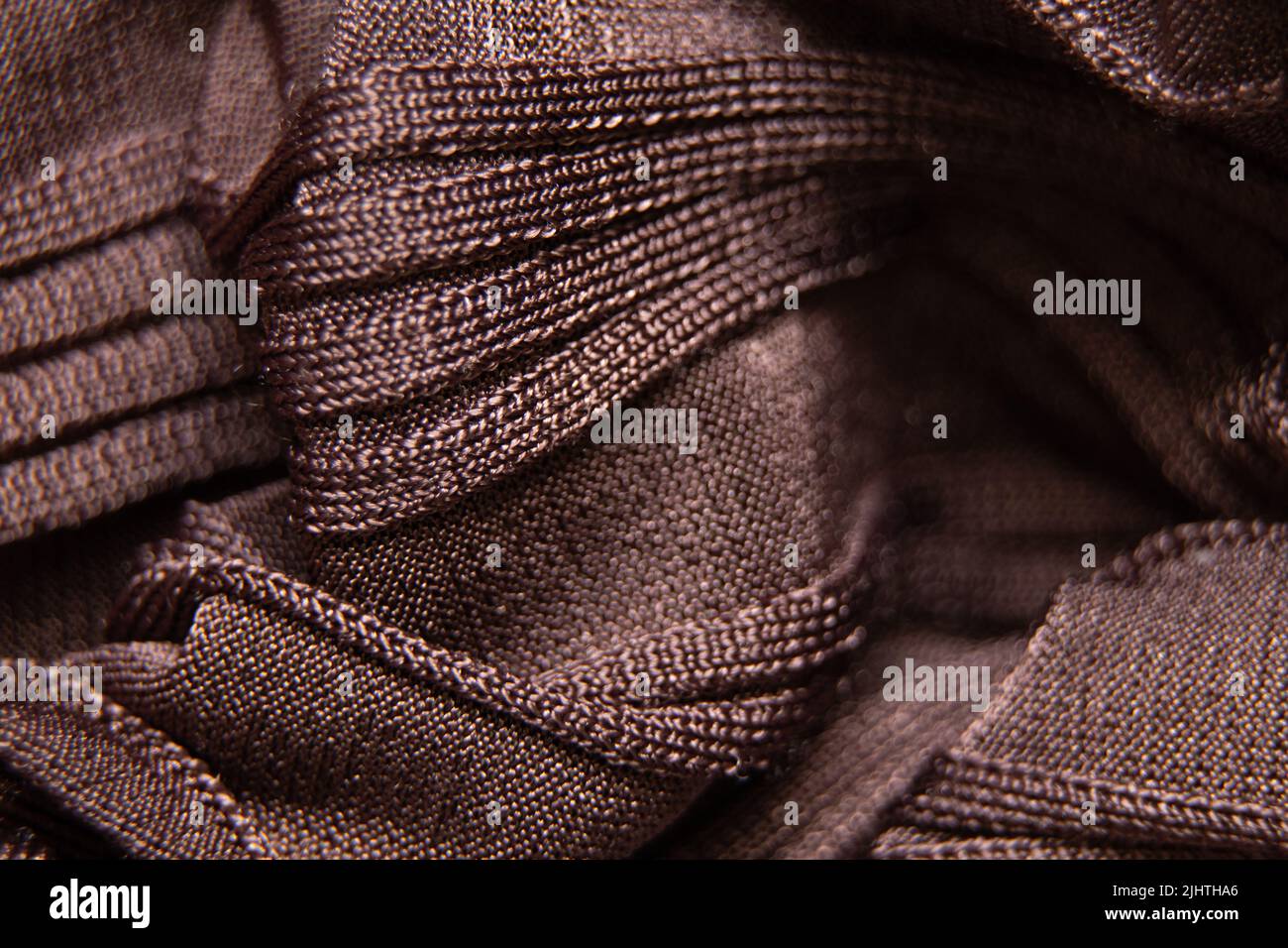 brown wrinkled silk fabric close up, wrinkled satin fabric as ...