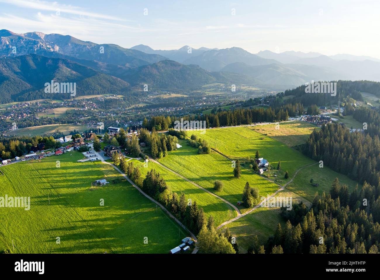 Aerial view of Zakopane town underneath Tatra Mountains taken from the ...