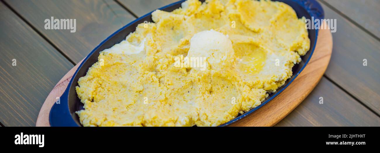 Traditional Montenegrin Meal. Kacamak in a black pan BANNER, LONG ...