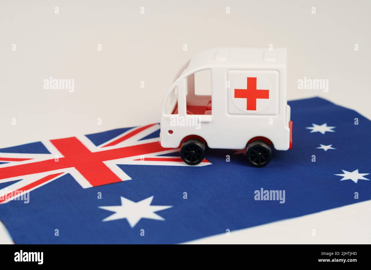Medical concept. The Australian flag features a toy ambulance Stock ...
