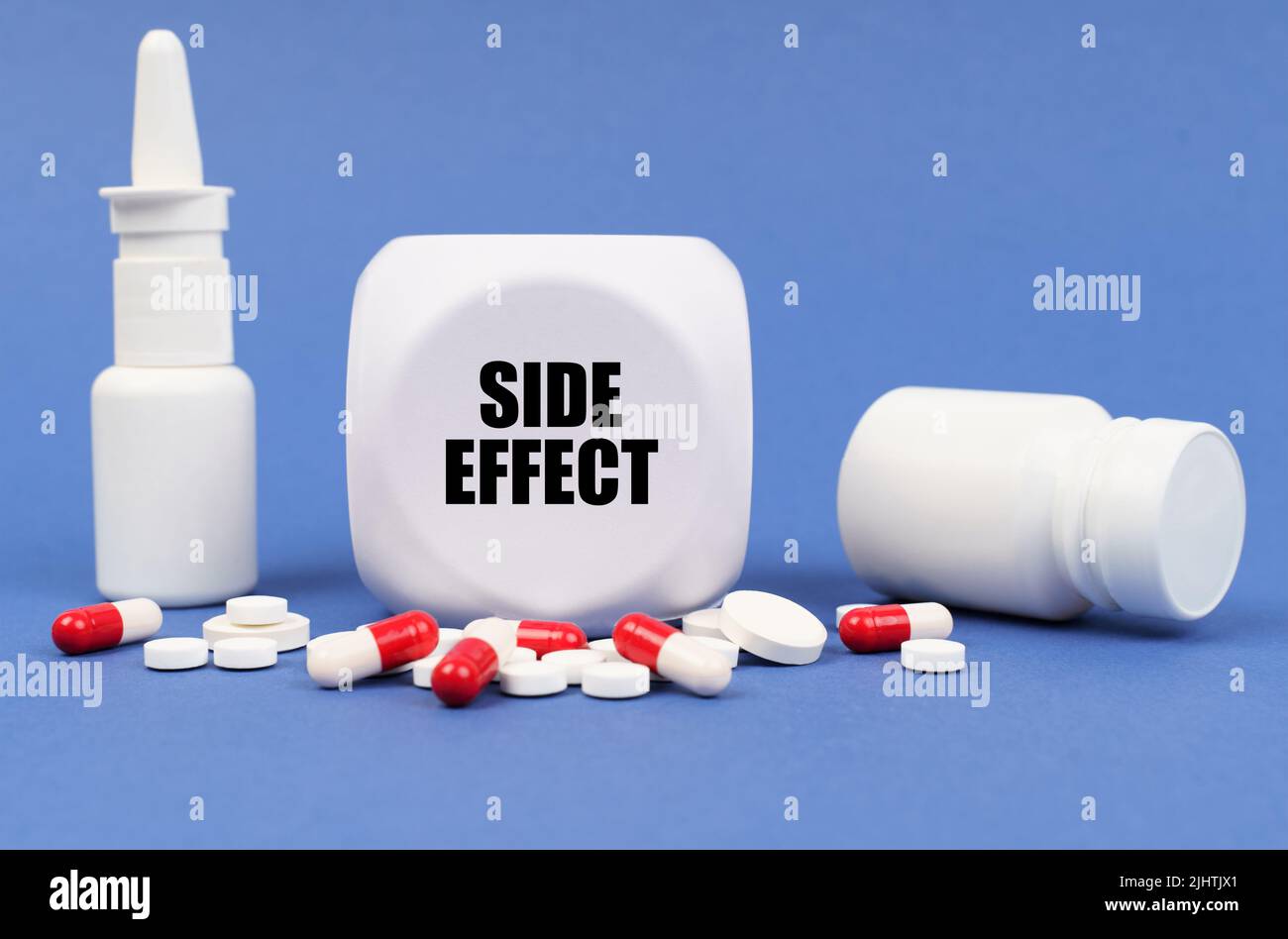 Medical concept. On the blue surface of the pill, capsule, spray, jar ...
