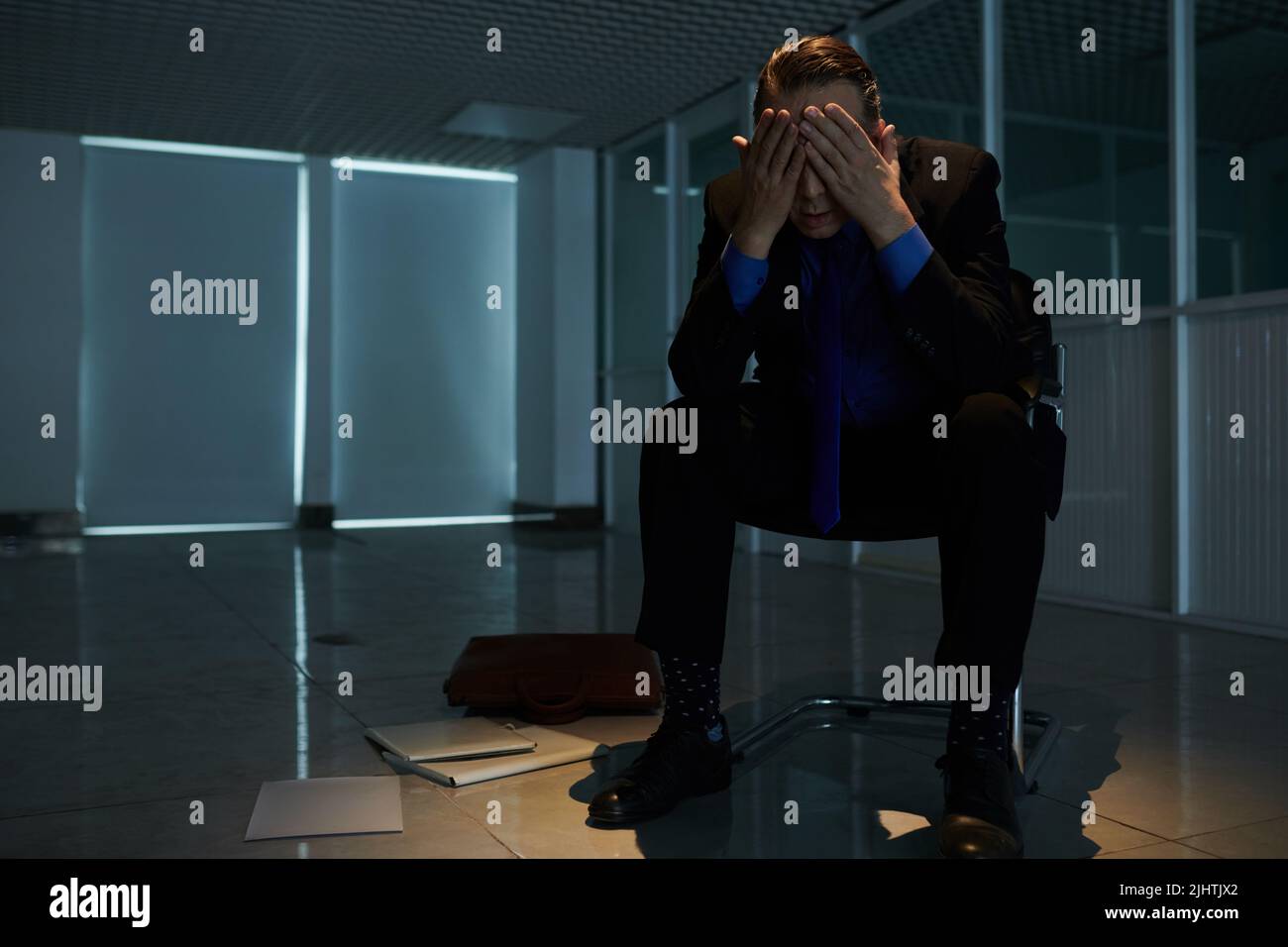Stressed ashamed businessman covering face with hands feeling bad after ...