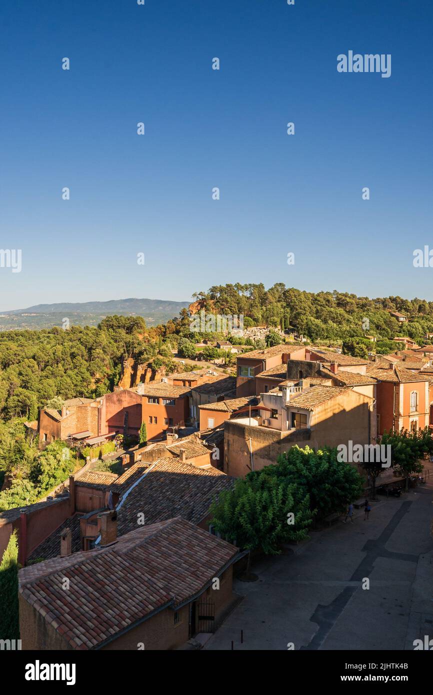 Street view of the small town of Roussillon, the red clay city in ...