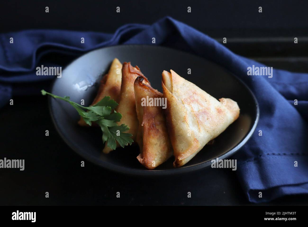 Samoosas. Also know as samosas. Deep fried snack Stock Photo - Alamy