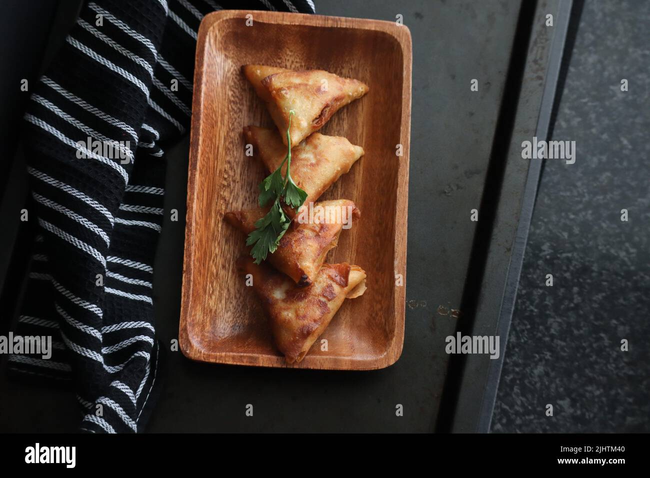 Samoosas. Also know as samosas. Deep fried snack Stock Photo - Alamy