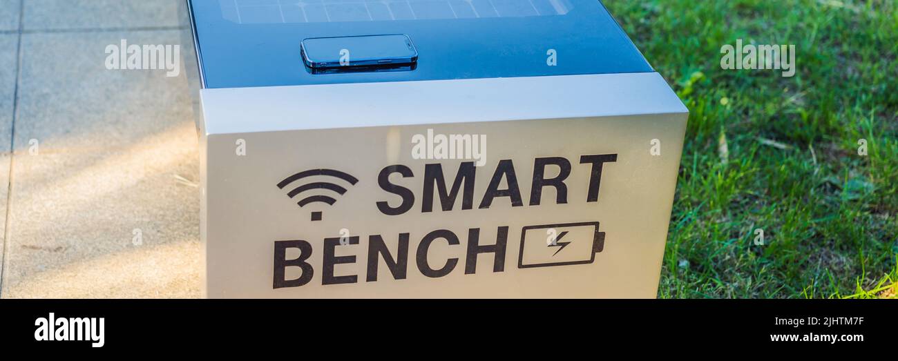 BANNER, LONG FORMAT New smart bench in local public park used for ...