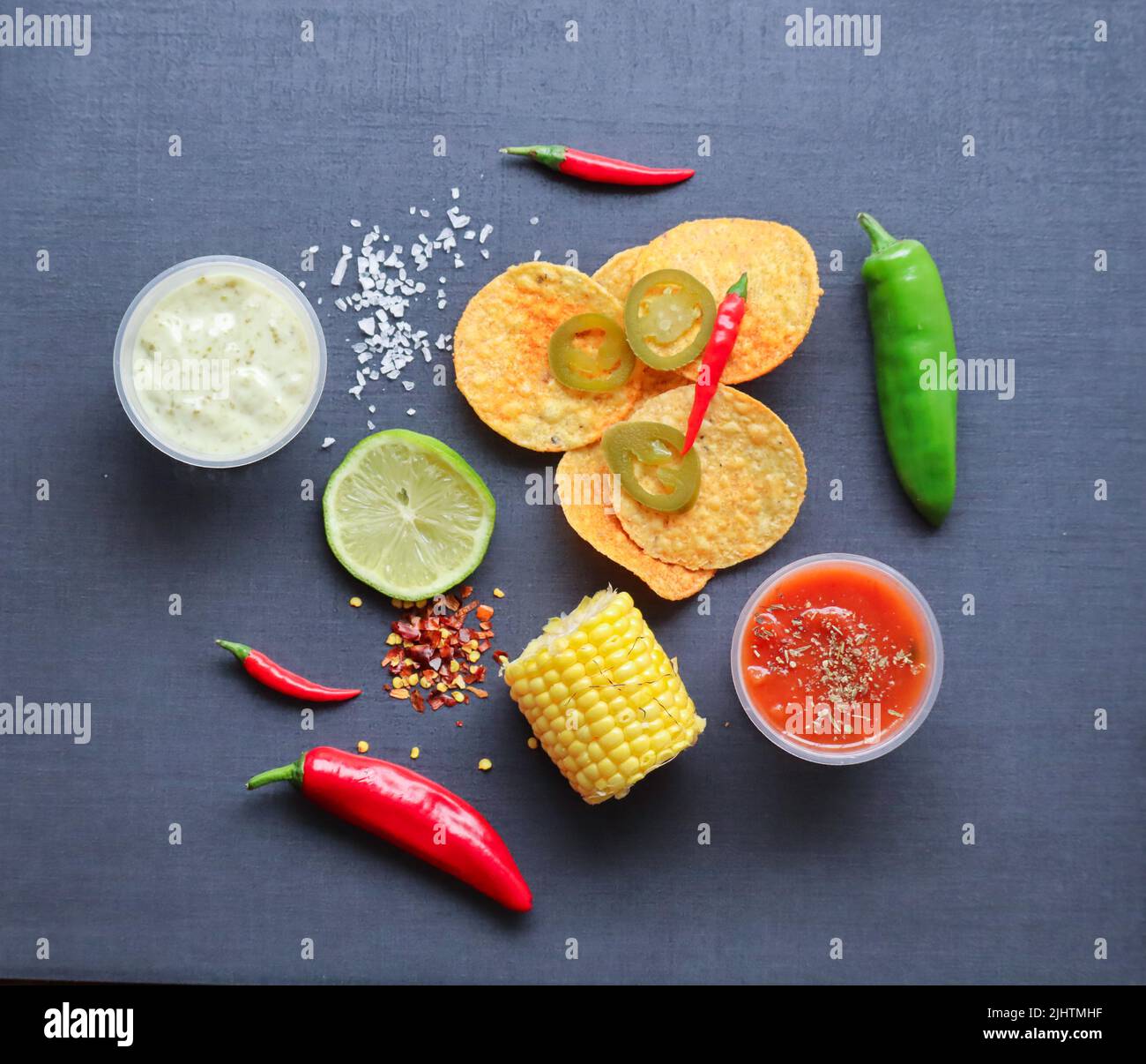 Ingredients for a nachos meal. Mexican food including nachos chips ...