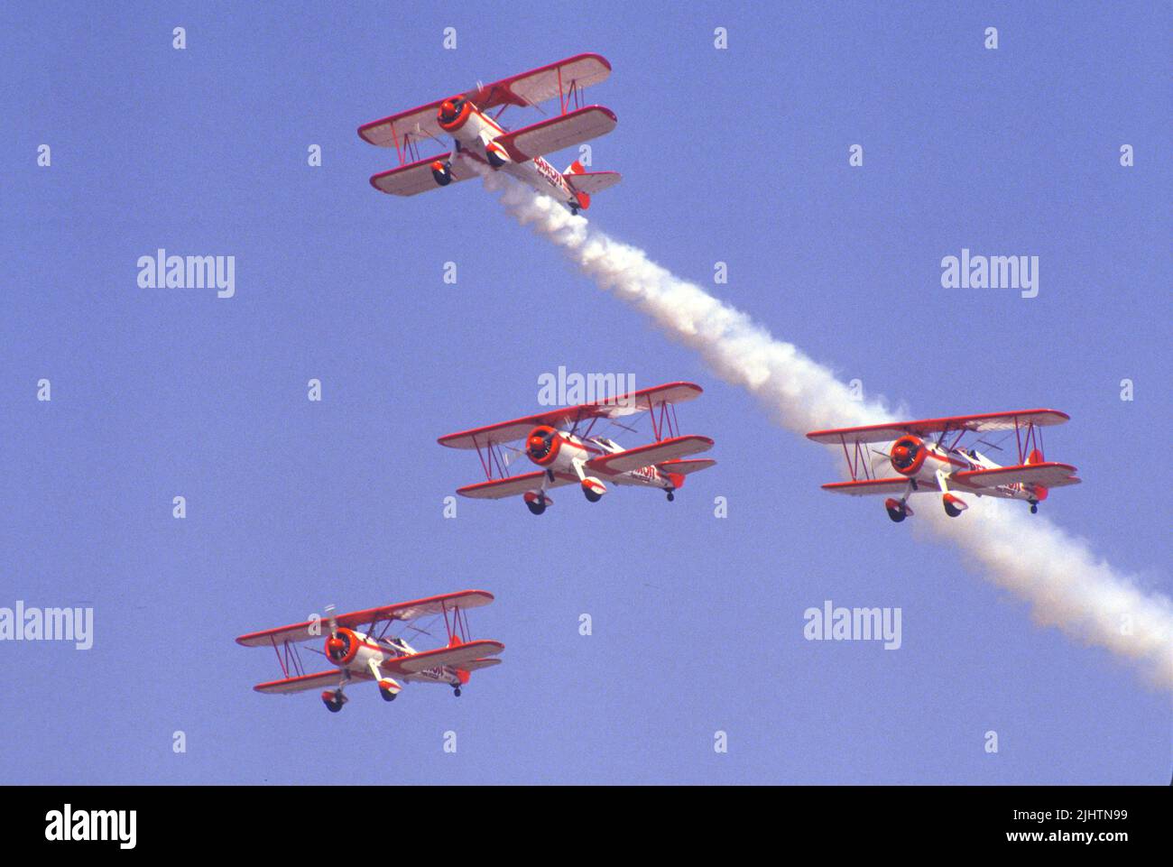 Red Baron Stearman Squadron in formation starting individual loops ...