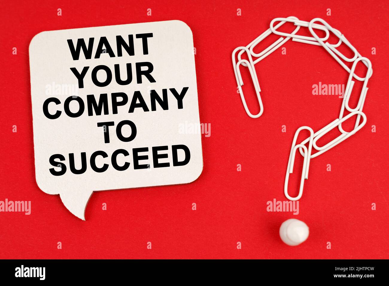 Economy and business concept. On a red background are a question mark ...
