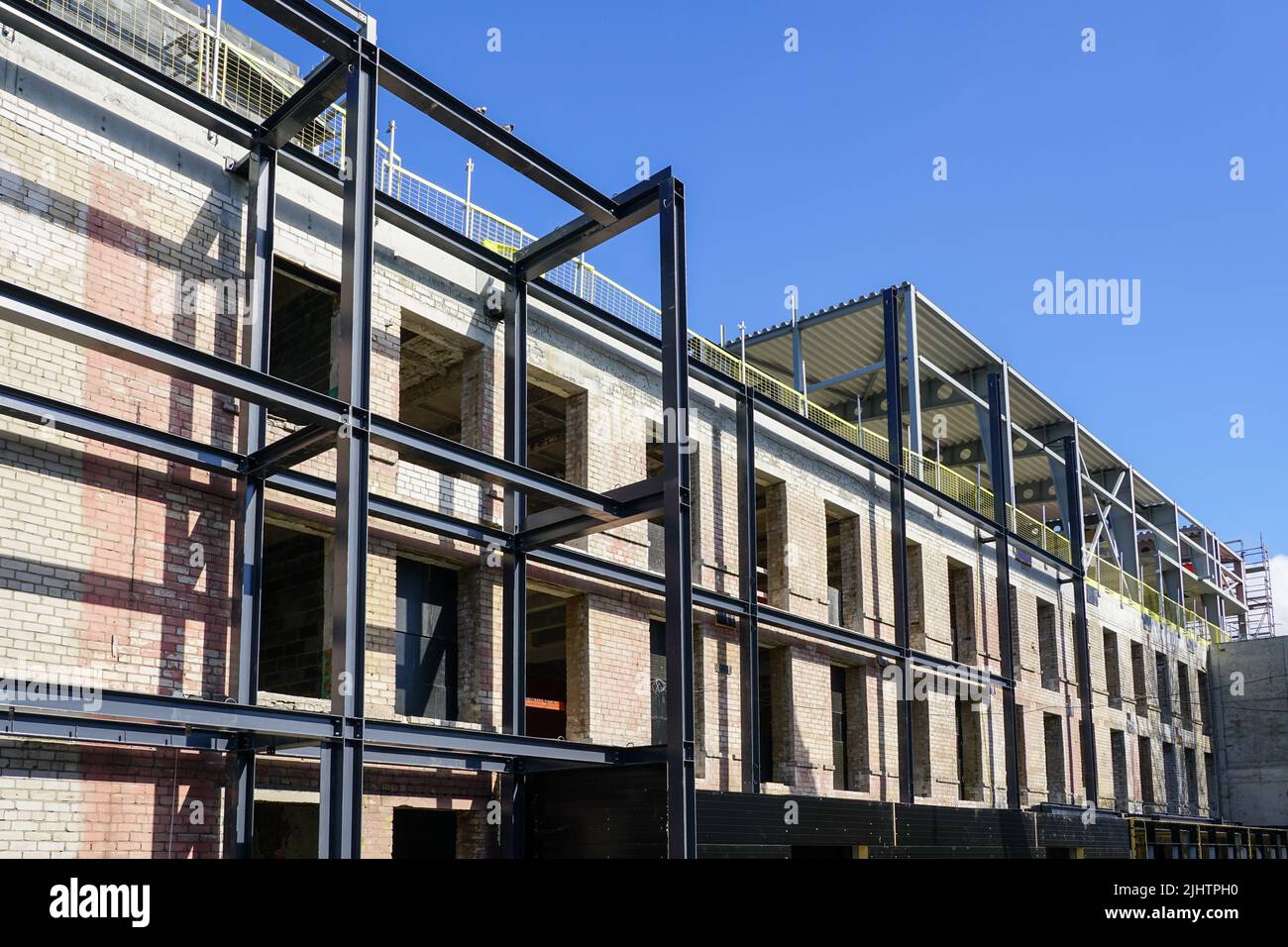 Reconstruction and modernization of an old brick building by expanding ...