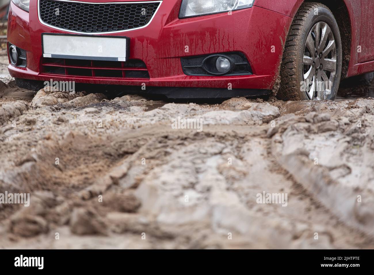 Car stuck in the mud, car wheel in dirty puddle, rough terrain Stock ...