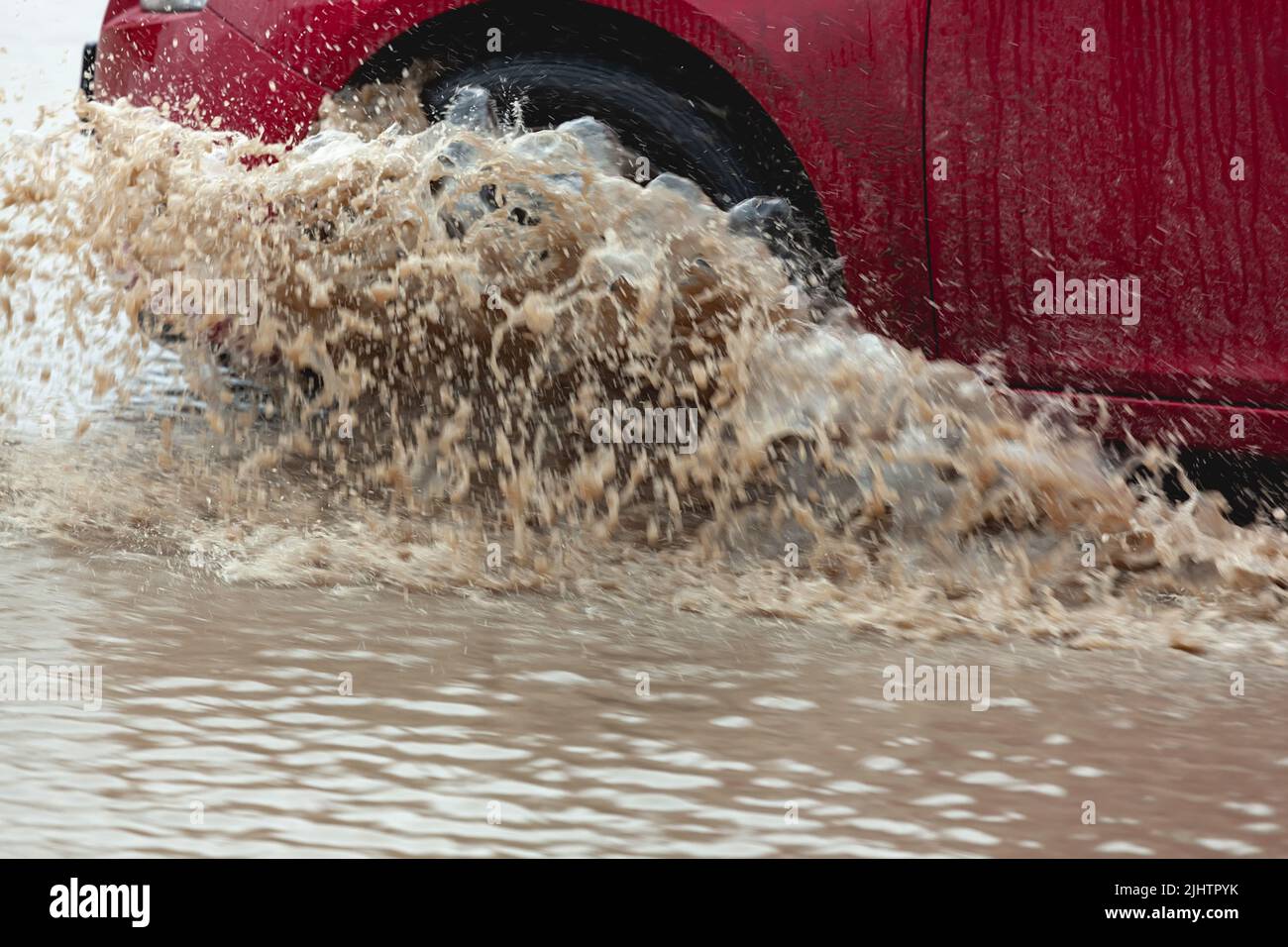 Car stuck in the mud, car wheel in dirty puddle, rough terrain Stock ...